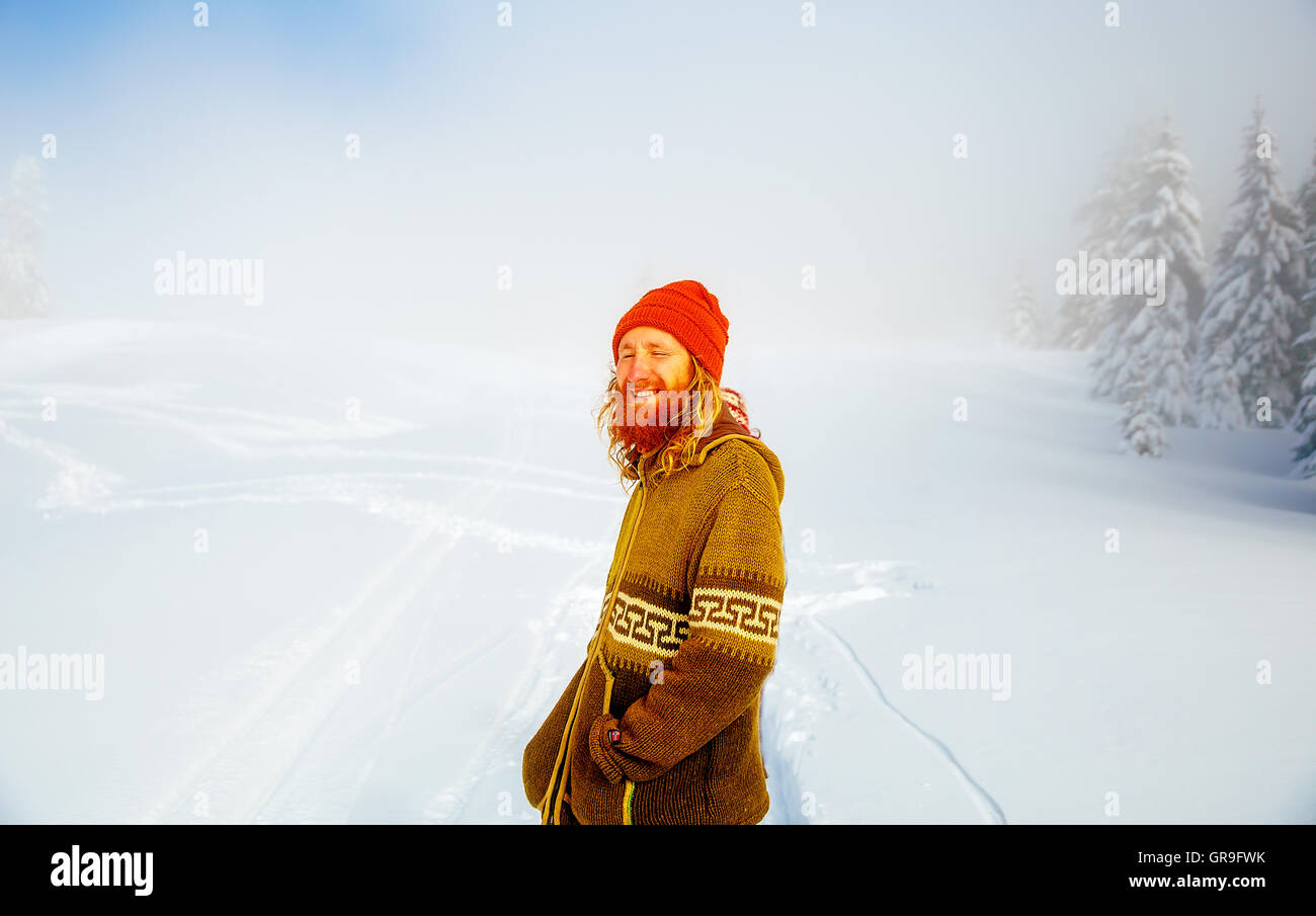 Beautiful smiling man in the Winter Landscape. Blur background Stock ...