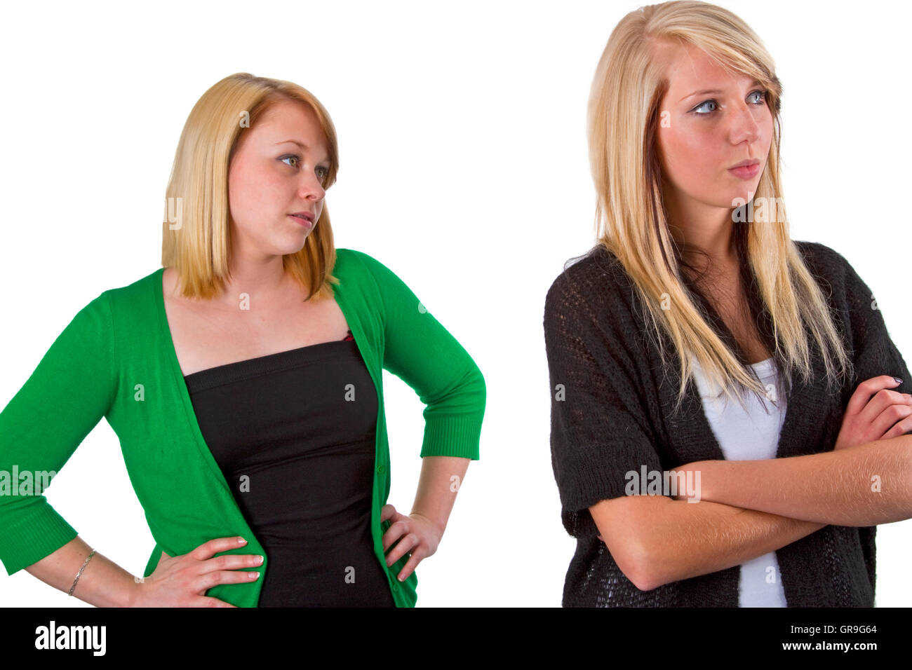 Two woman friends have an argue with each other- isolated on white ...