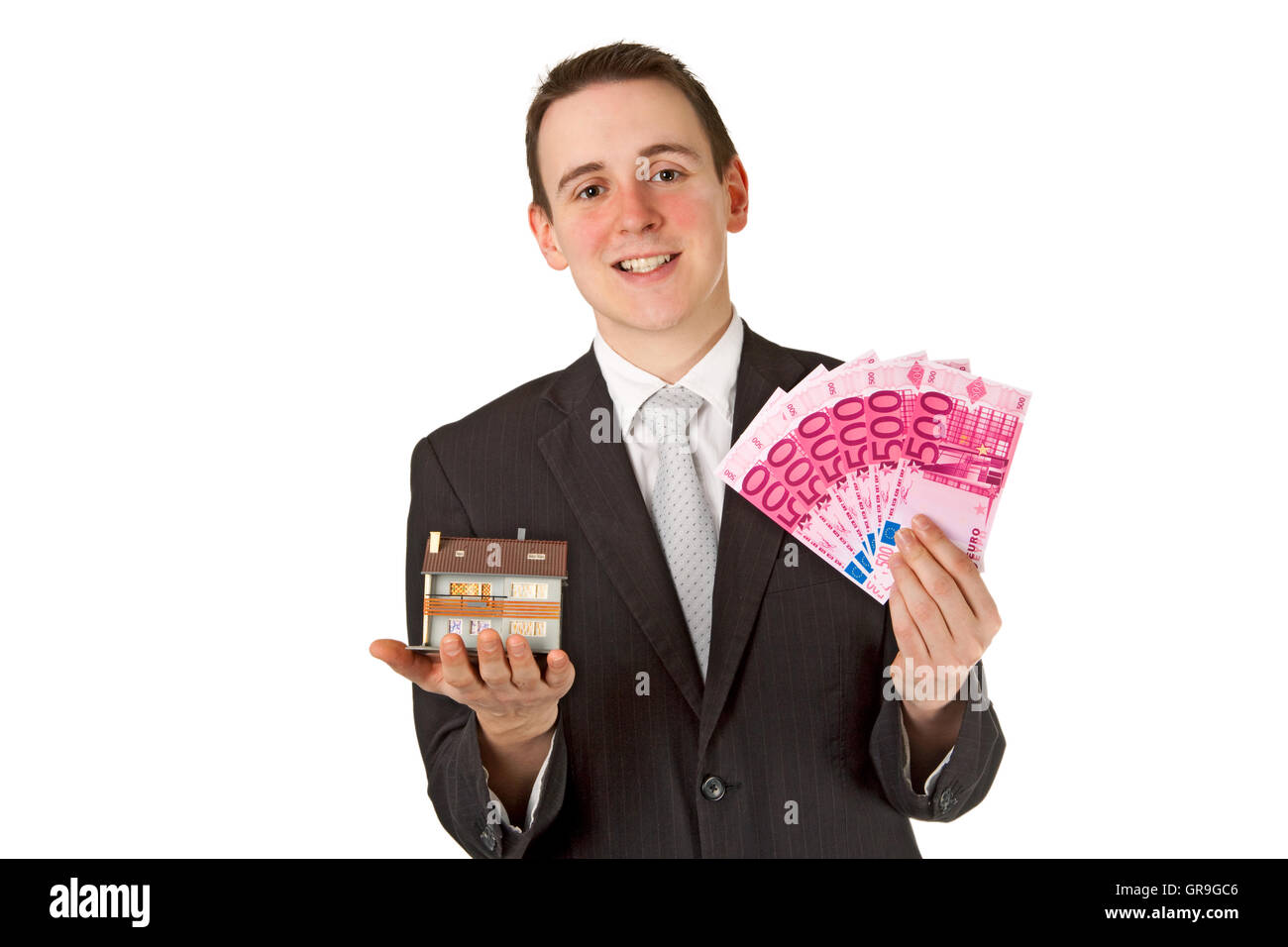 Friendly real estate agent isloated on white background Stock Photo - Alamy