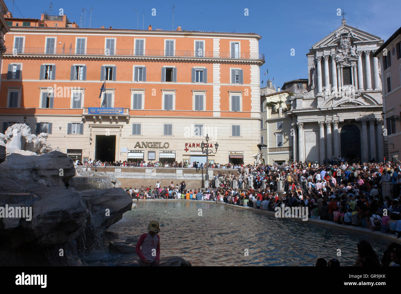 The Trevi Fountain full of people (Italian: Fontana di Trevi) is a ...