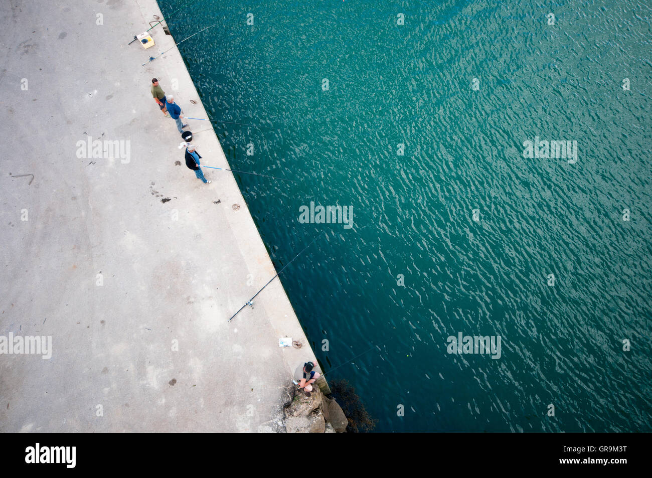 Angler On A Quay Seen From Above Stock Photo - Alamy