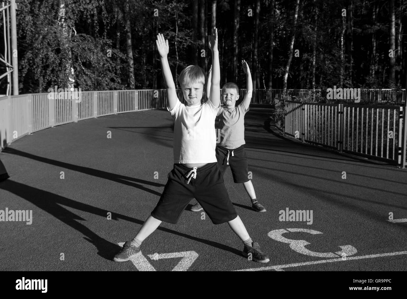 Children doing morning exercises outdoor Stock Photo - Alamy