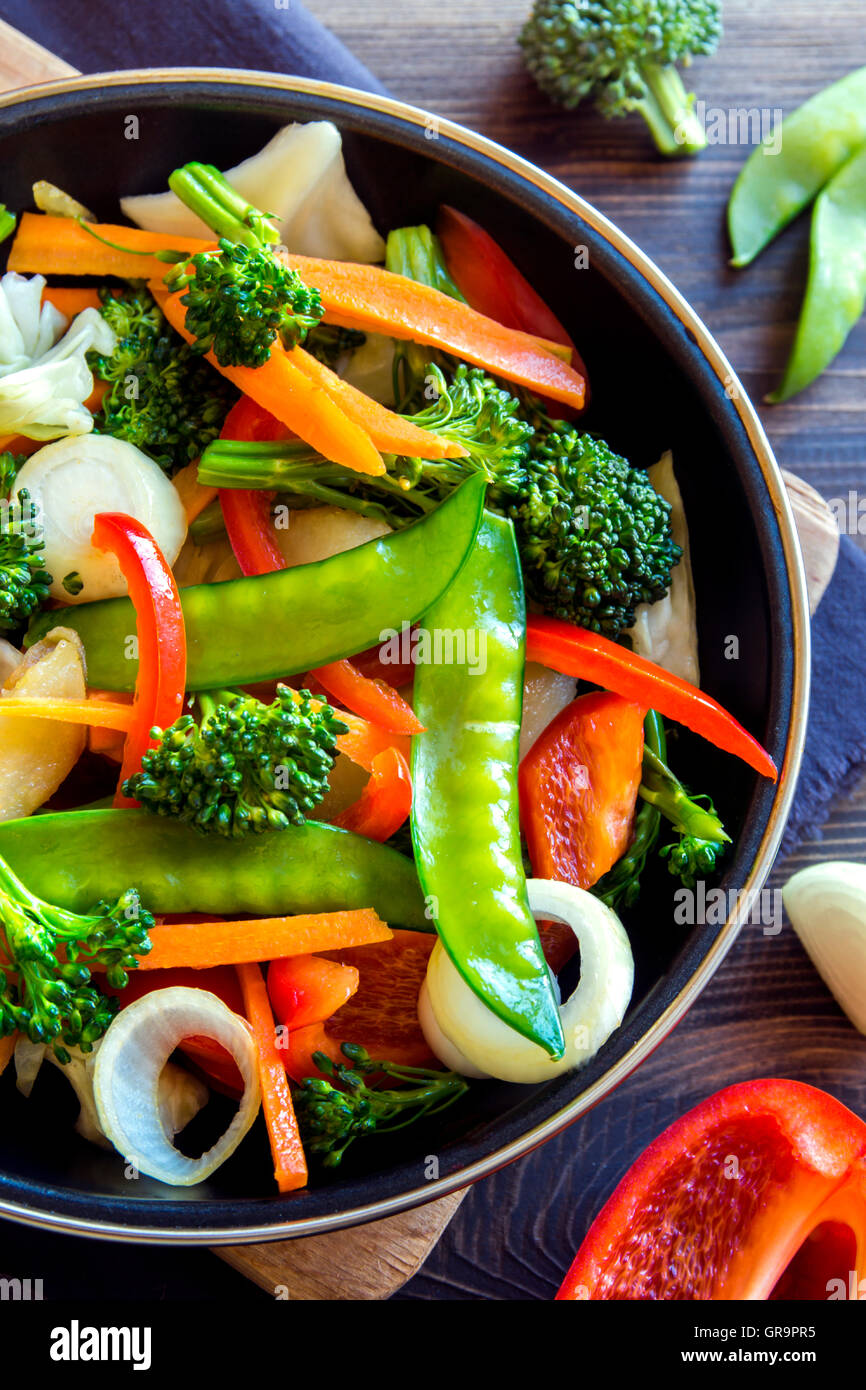 Healthy stir fried vegetables in the pan and ingredients close up ...