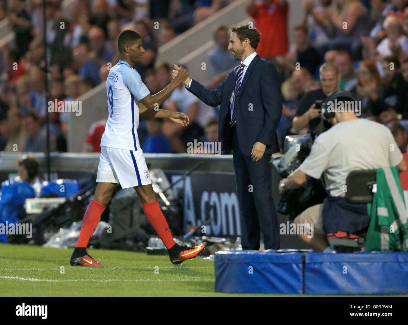 England U21 manager Gareth Southgate speaks with Marcus Rashford as he ...