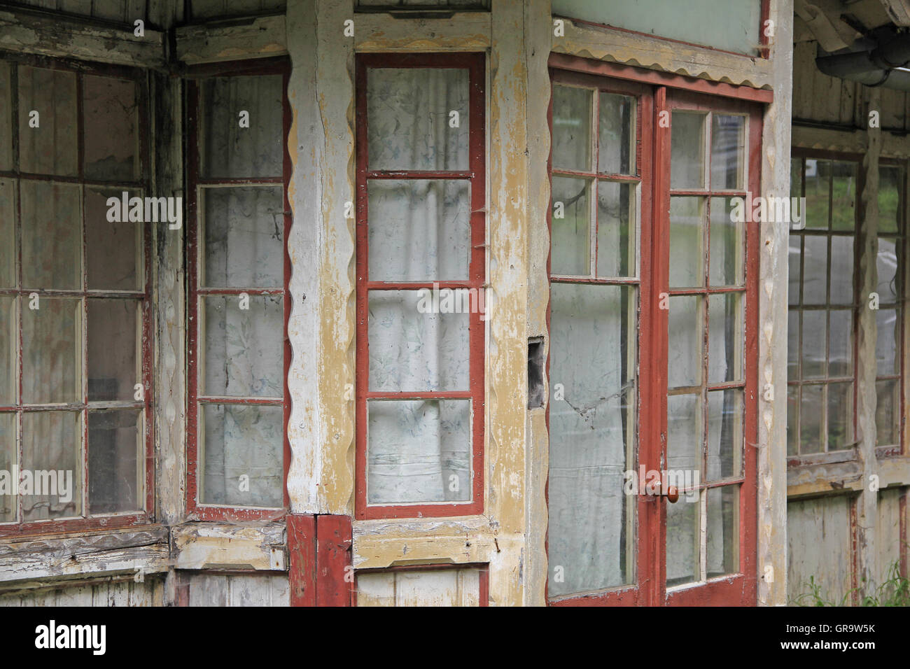 Old Wooden House With Glass Windows Stock Photo - Alamy