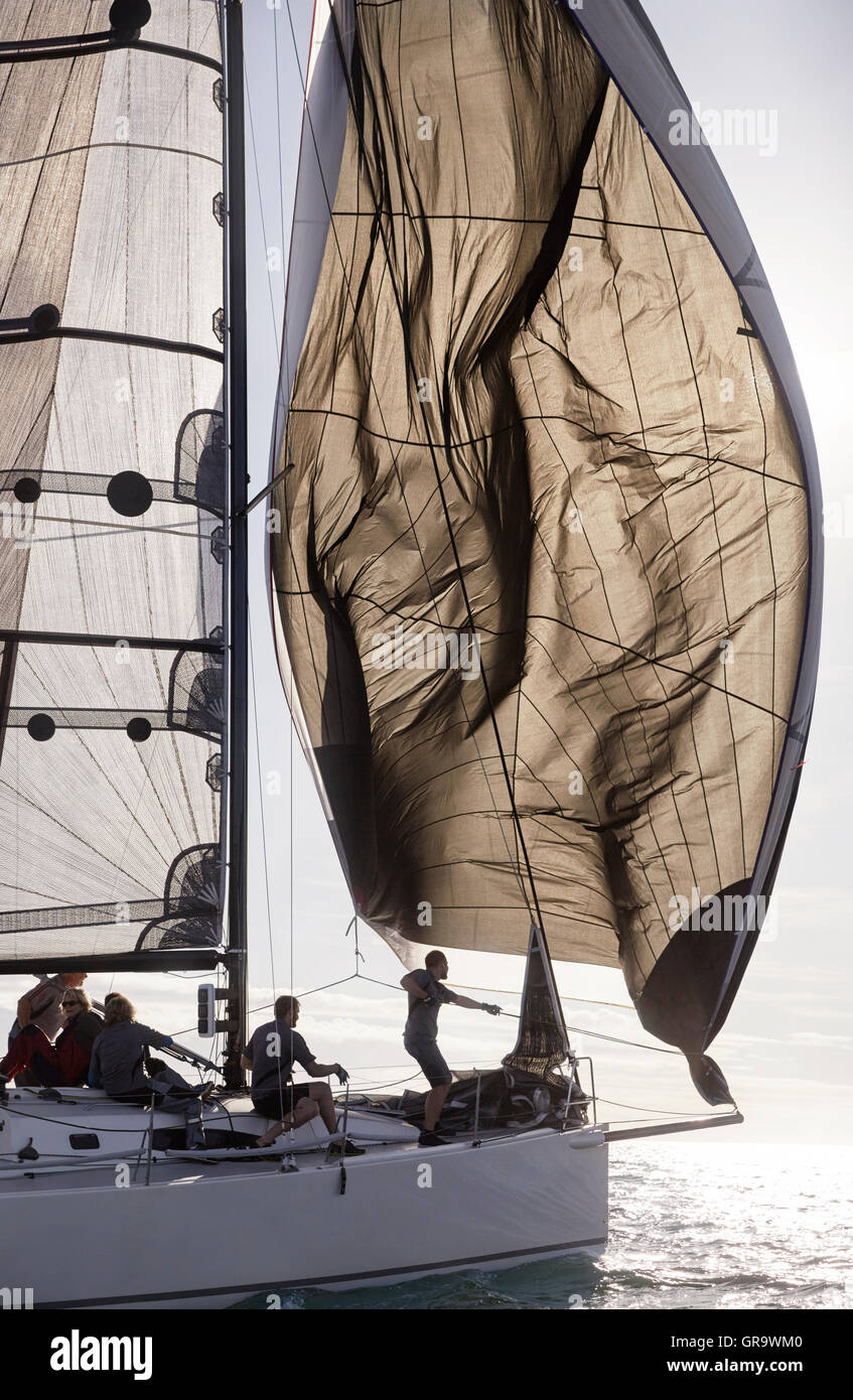 Man adjusting sail on sailboat hi-res stock photography and images - Alamy