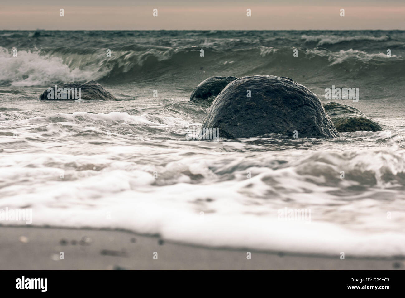 Rocks In The Surf Stock Photo - Alamy