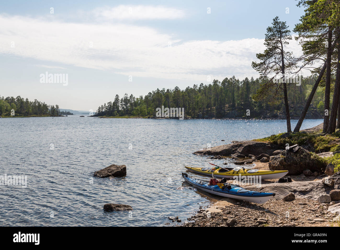 Two Sea Kayaks On The Shore Of Lake Inari In Nothern Lapland In Finland ...
