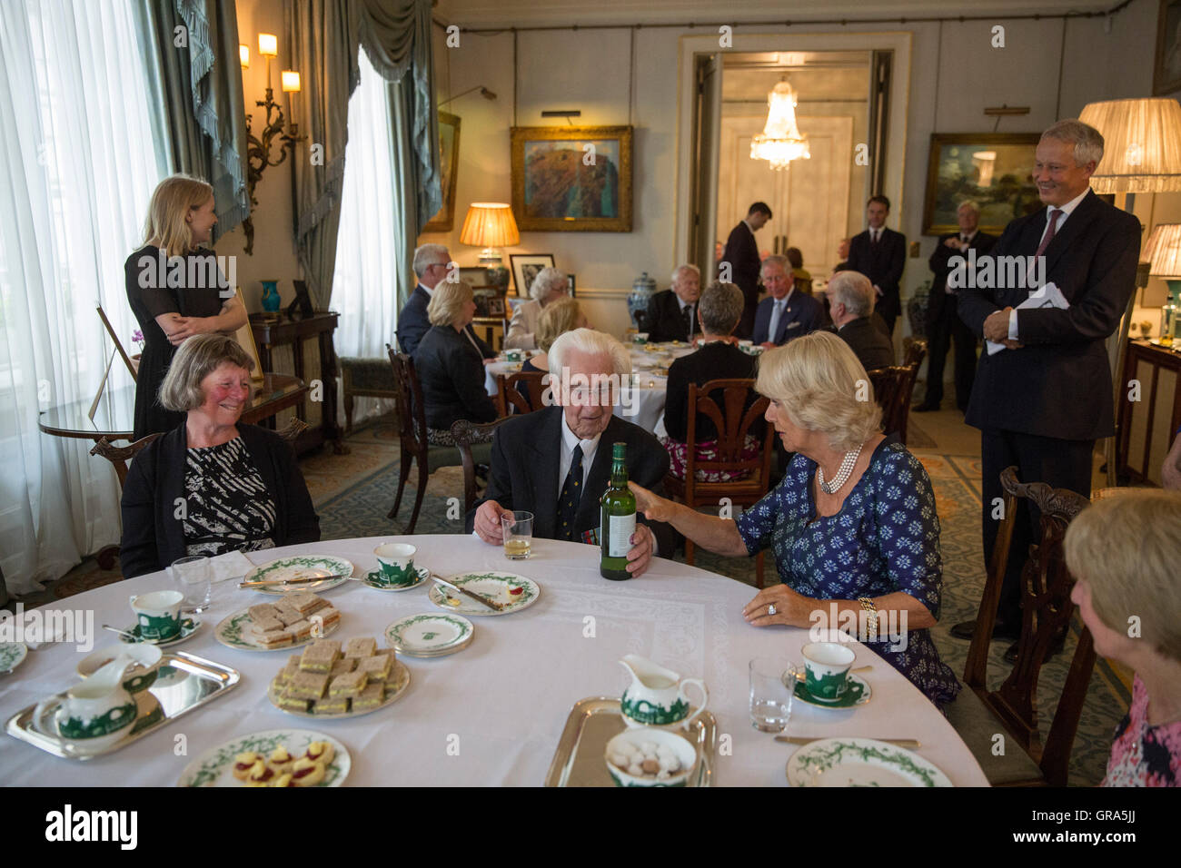 The Duchess of Cornwall (right) presents Flight Officer Ken Wilkinson ...