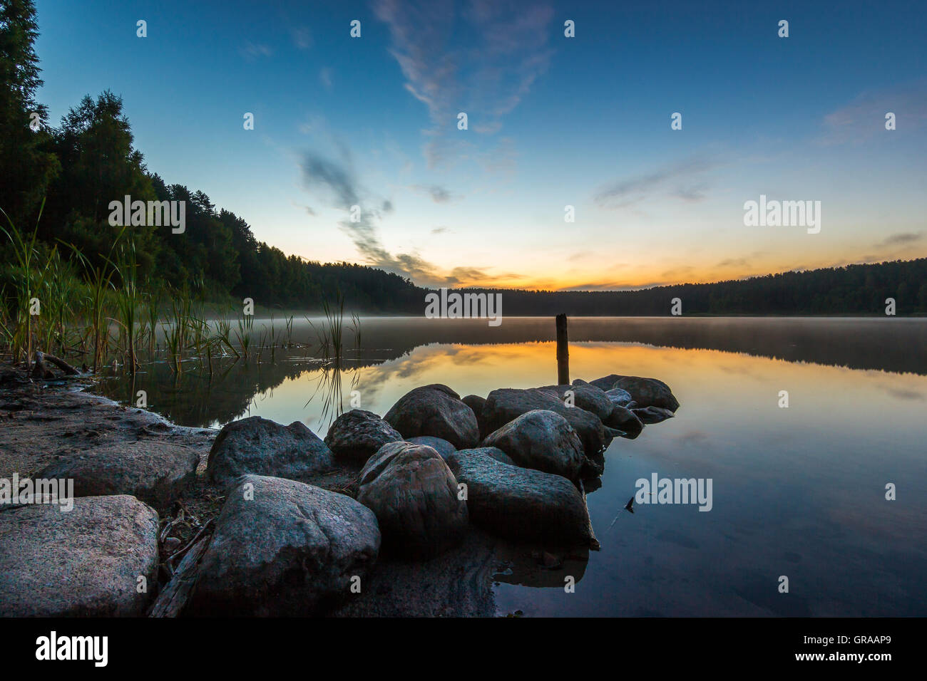 Sunrise over lake Stock Photo - Alamy