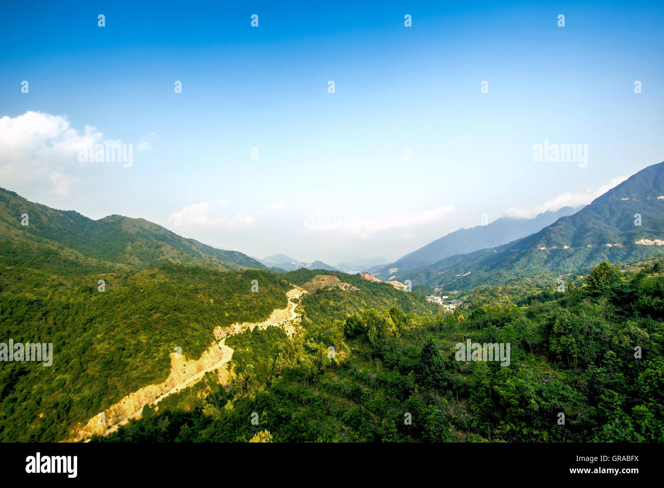 Blue sky and white clouds Castle Peak natural scenery Stock Photo - Alamy