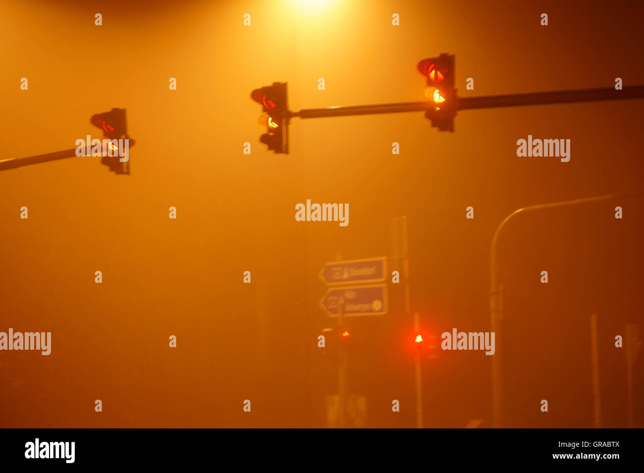 Traffic Lights In The Fog Stock Photo - Alamy