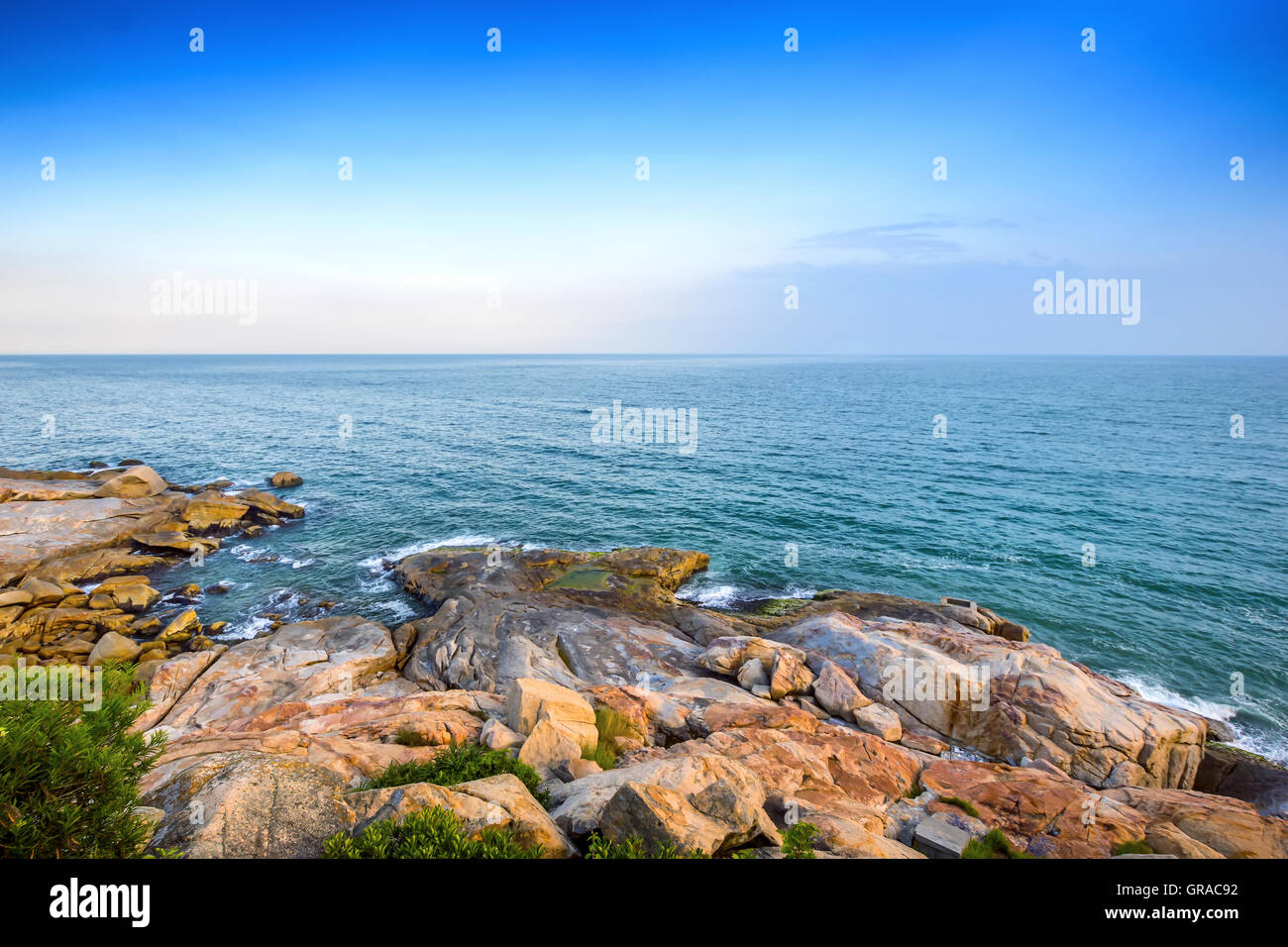 Blue rock beach scenery Xunliao Bay Stock Photo - Alamy