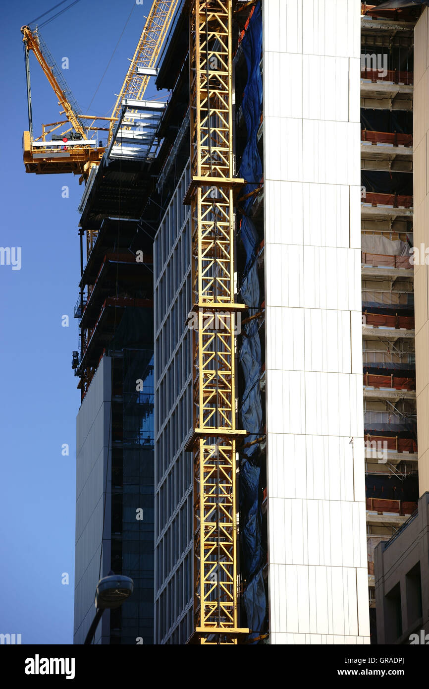 Crane On Skyscraper Stock Photo - Alamy