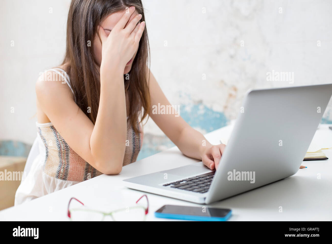 Pretty young woman working on laptop in the office Stock Photo - Alamy