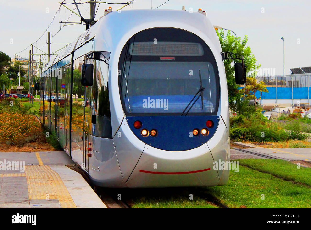 Modern light electric tram on the move, Athens, Greece Stock Photo - Alamy