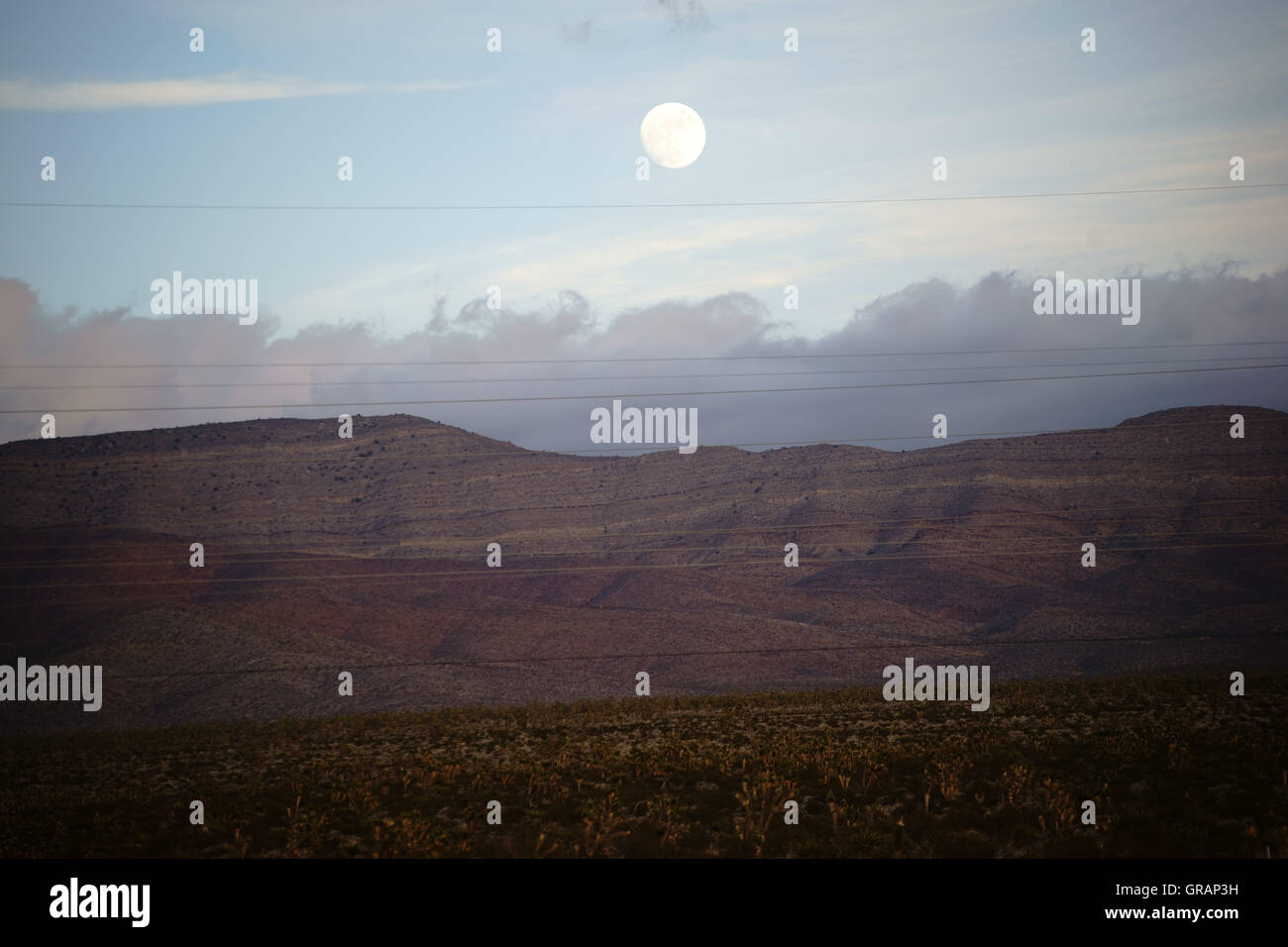 Full Moon Over The Mountains Stock Photo - Alamy