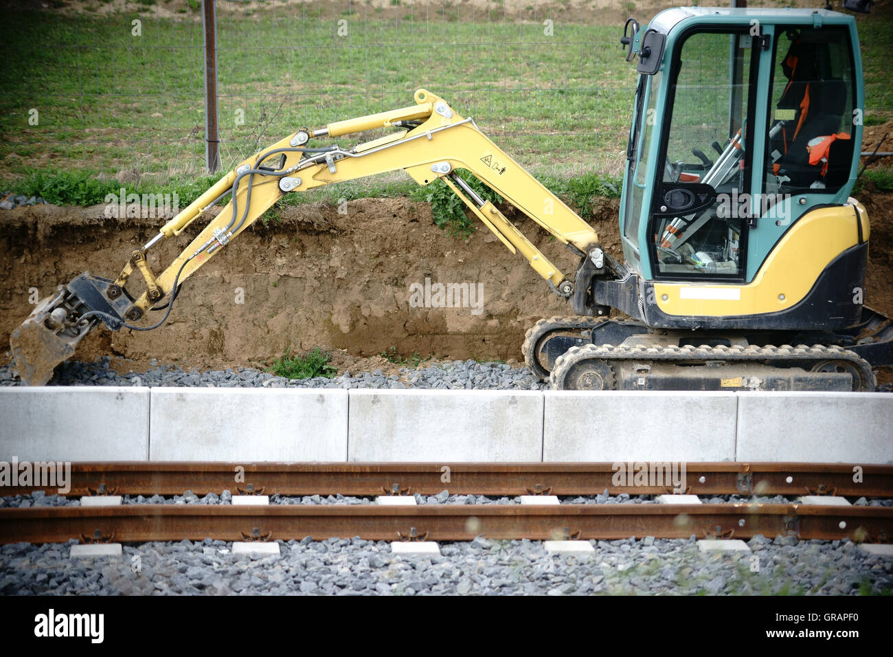 Excavators At The Railway Works Stock Photo - Alamy