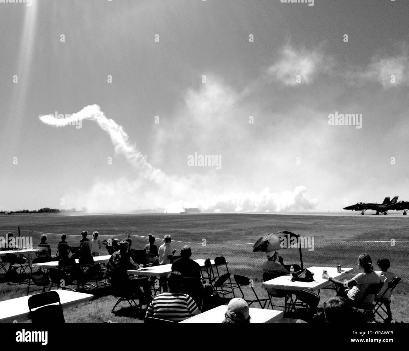 Crowd Watching Airplane Against Cloudy Sky On Sunny Day Stock Photo - Alamy