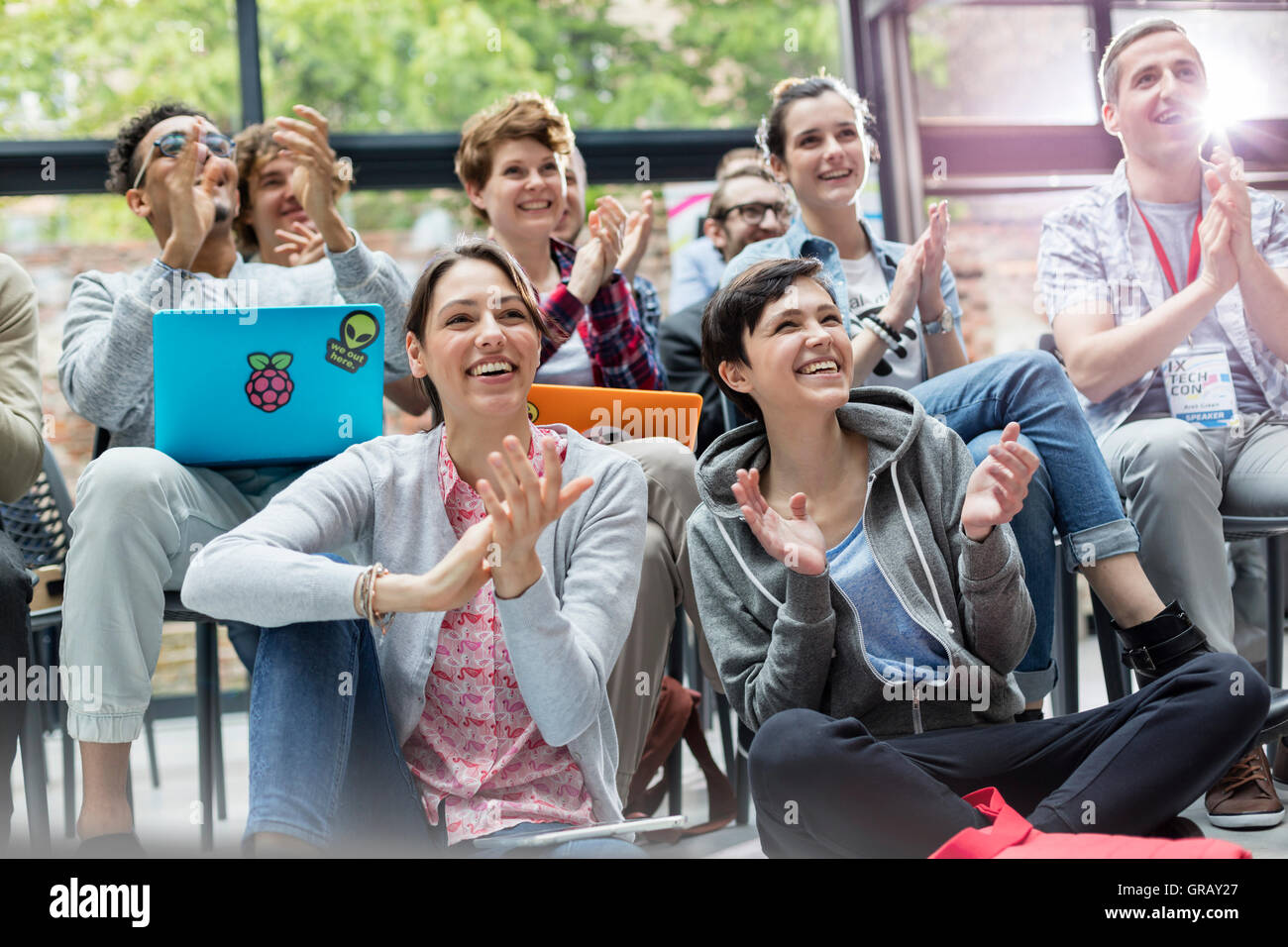 Smiling audience clapping at technology conference Stock Photo - Alamy Smiling audience clapping at technology conference Stock Photo - Alamy