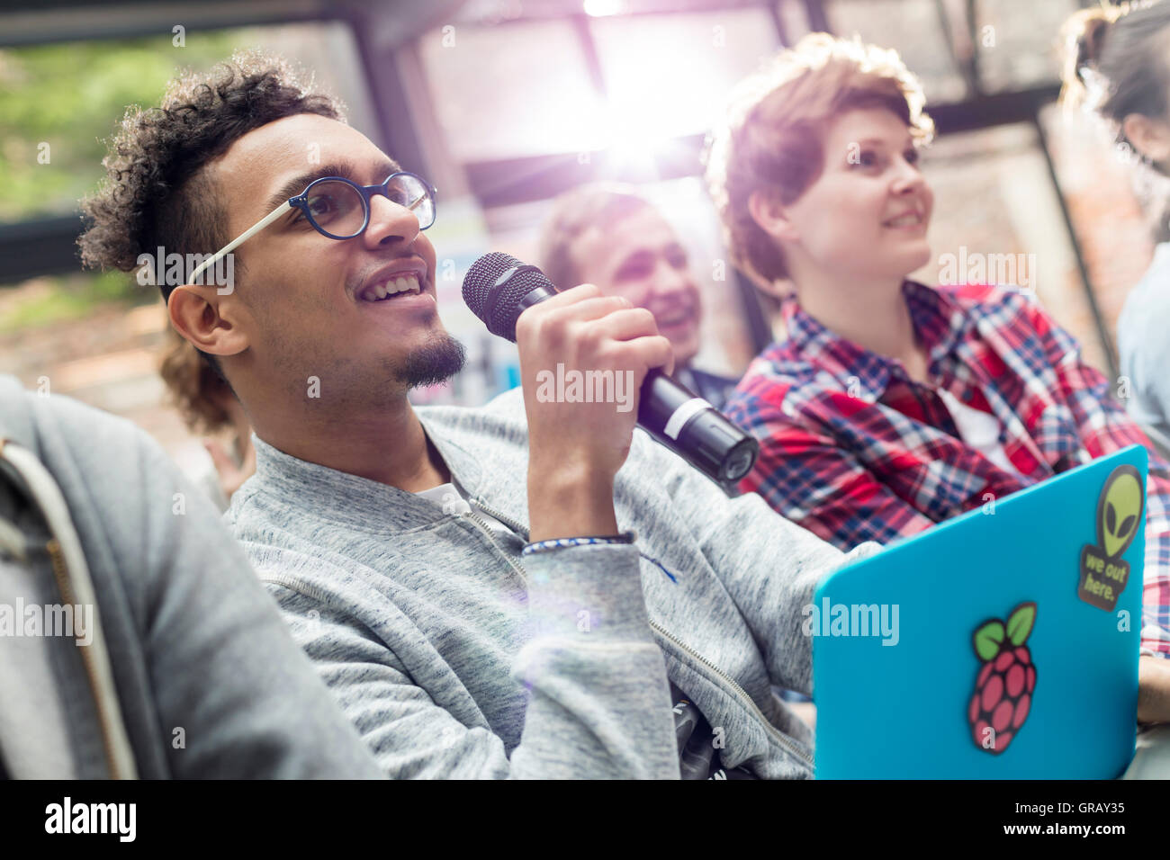 College student talking microphone hi-res stock photography and images ...