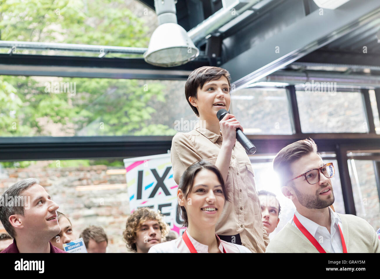 College student talking microphone hi-res stock photography and images ...