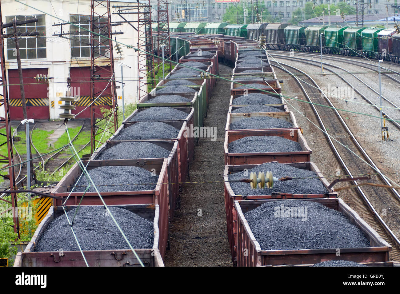 Freight train with color cargo containers passing railway station Stock ...
