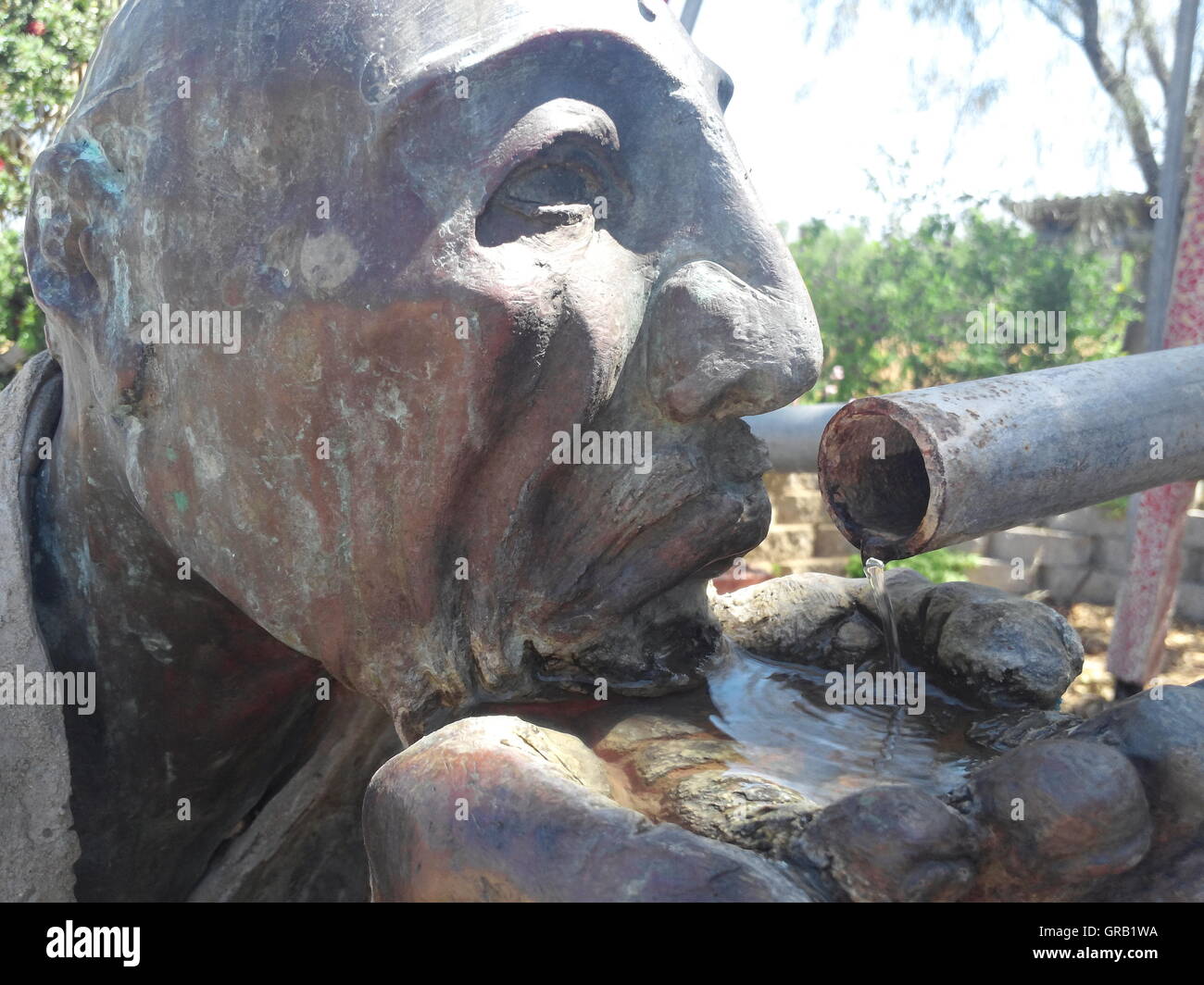 Close-Up Of Sculpture By Water Pipe Stock Photo - Alamy
