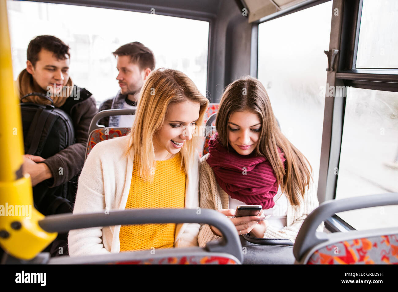 Group of young people traveling by bus, having fun Stock Photo - Alamy