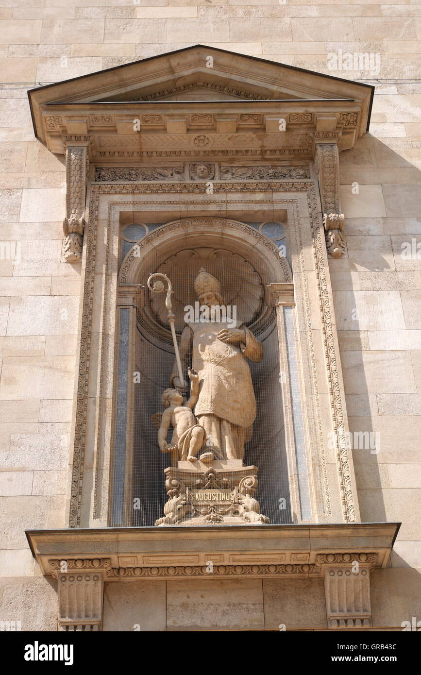 Statue of St Augustine in a niche on the wall of St Stephen's Basilica ...