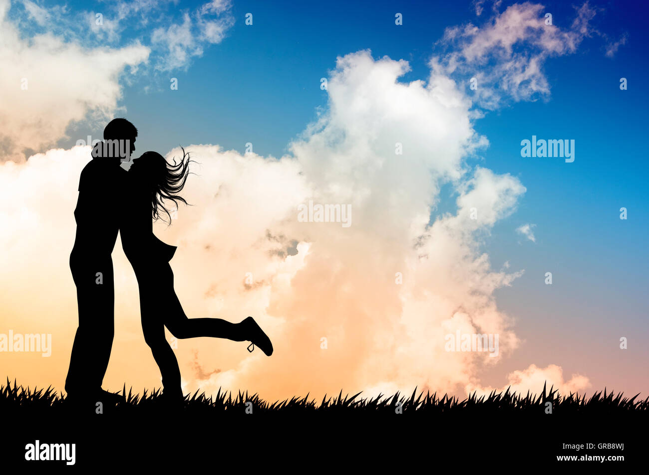 Lovers at sunset Stock Photo - Alamy