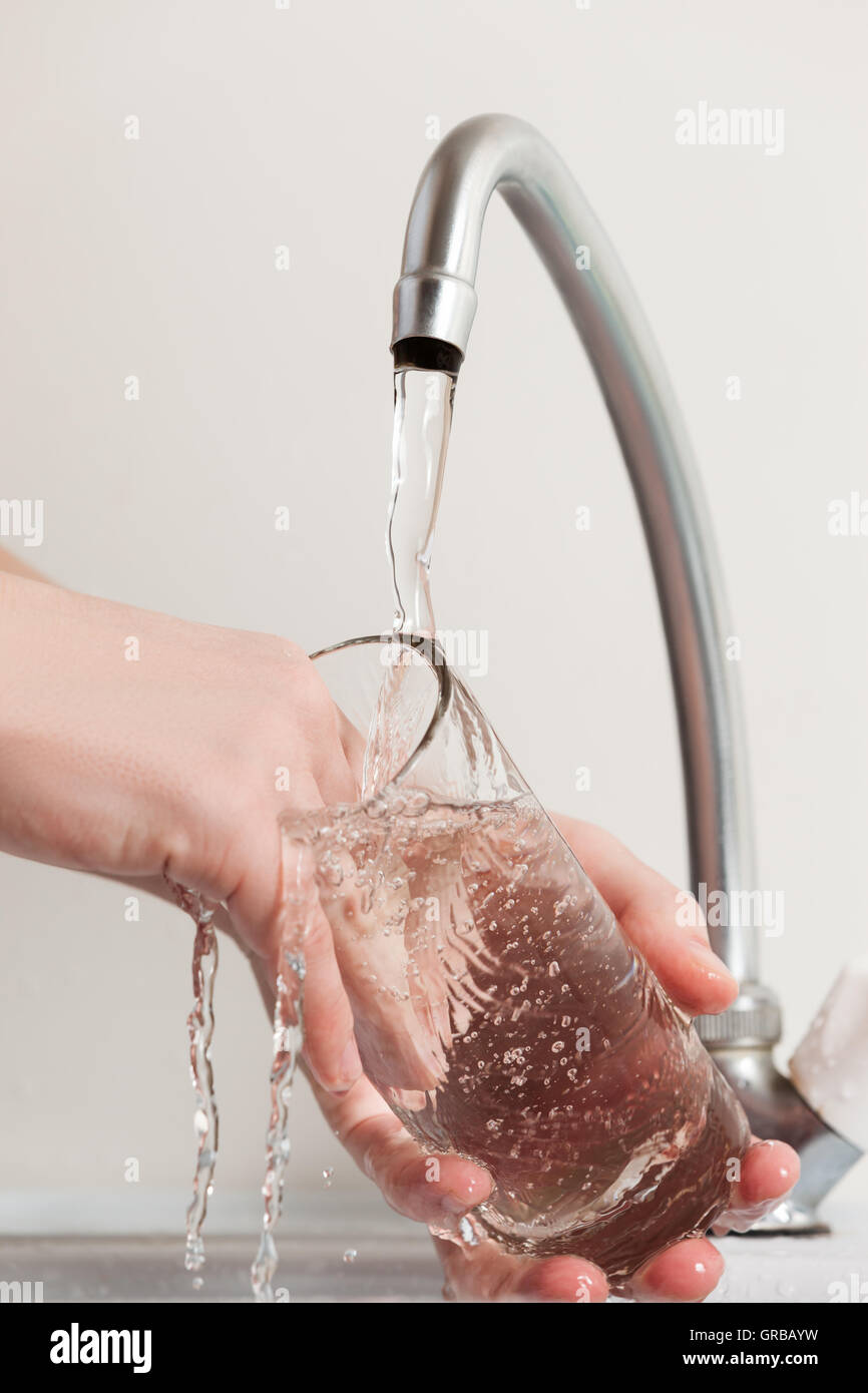 Water tap drop hand hi-res stock photography and images - Alamy