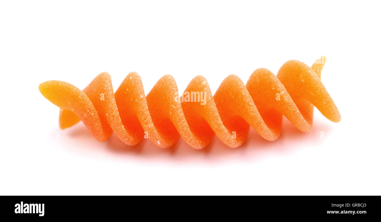 One piece of Italian red rotini pasta isolated Stock Photo - Alamy