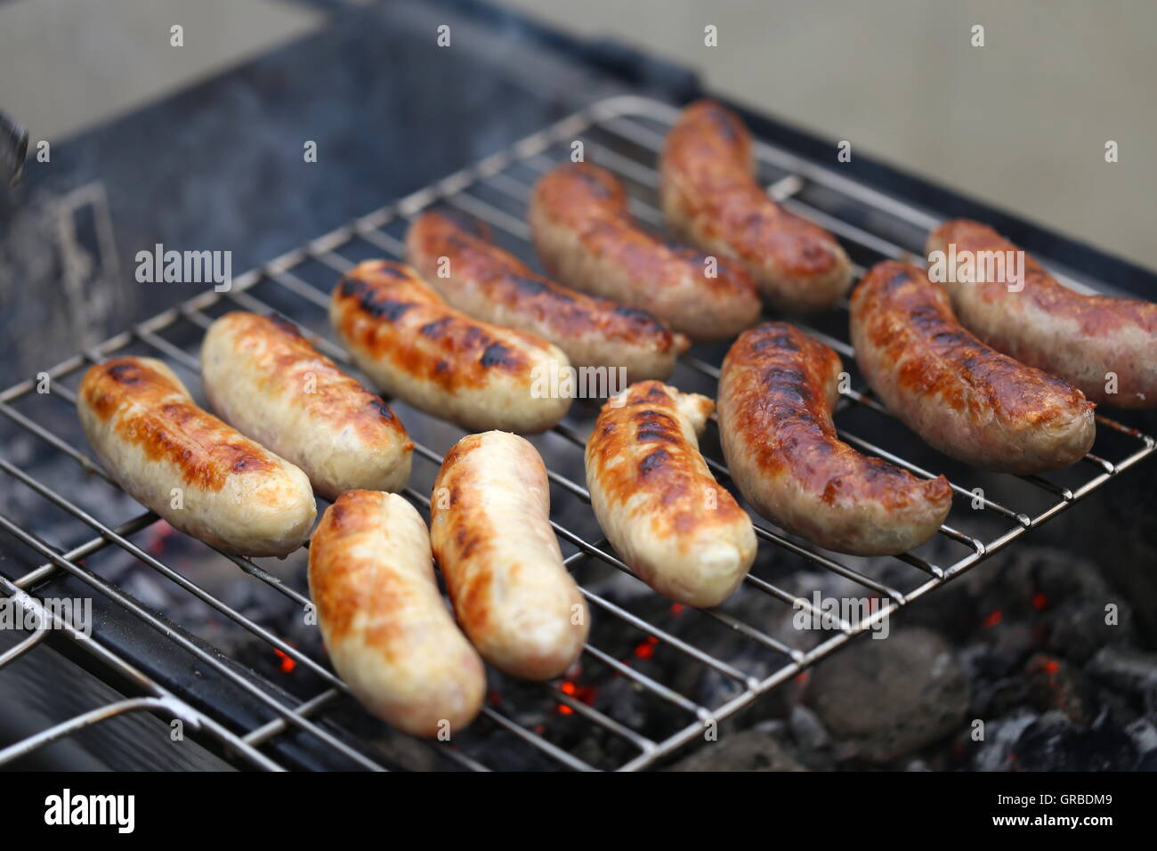 Sausages on grill Stock Photo - Alamy