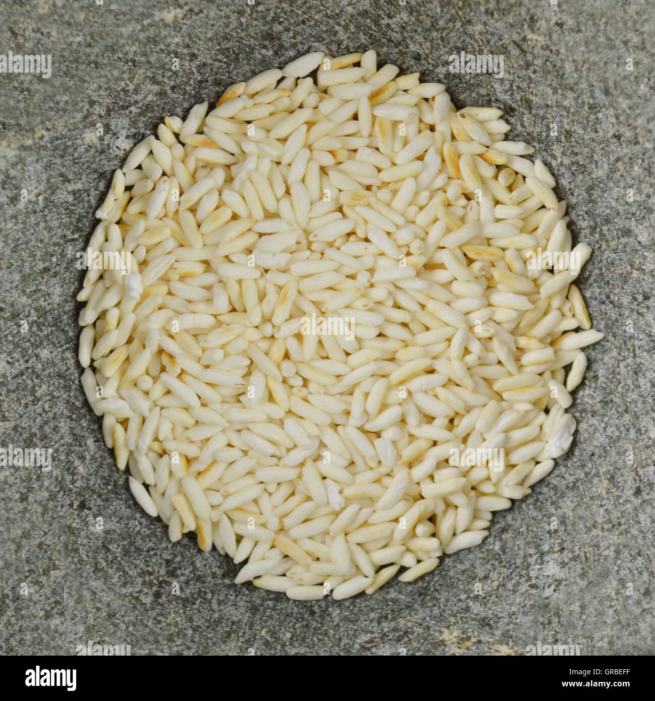 Parched rice in a mortar Stock Photo - Alamy
