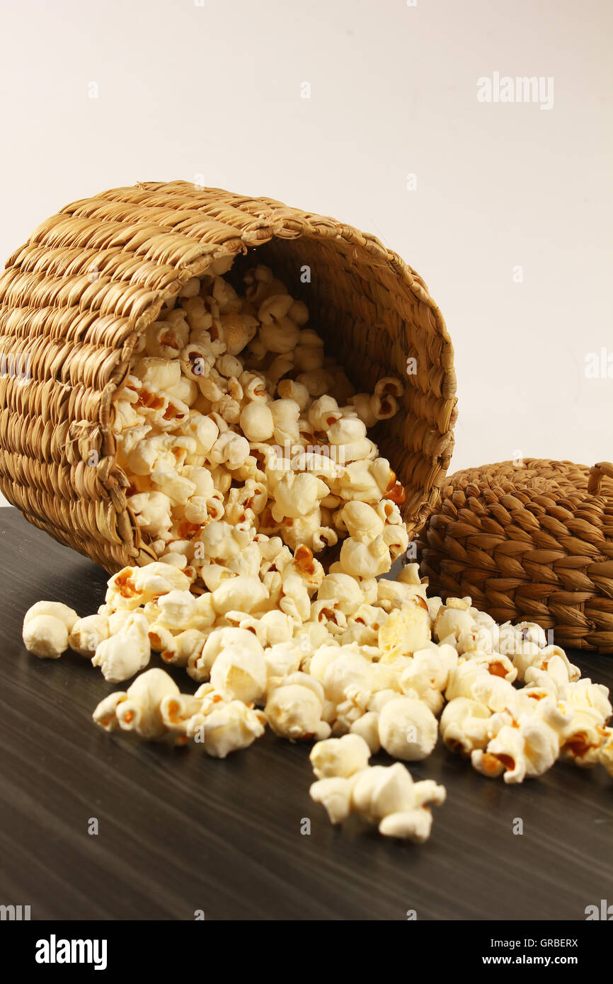 popcorn in bowl isolated with white and brown background Stock Photo ...