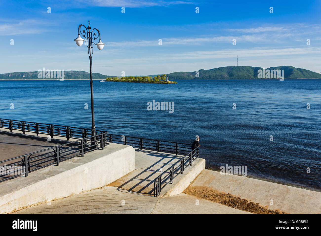 Street lights on the promenade of great river Stock Photo - Alamy