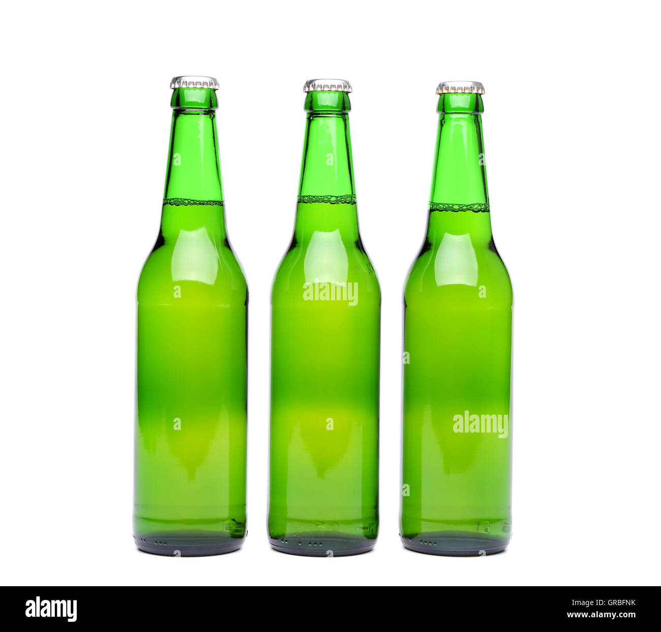 Three green beer bottle Stock Photo - Alamy