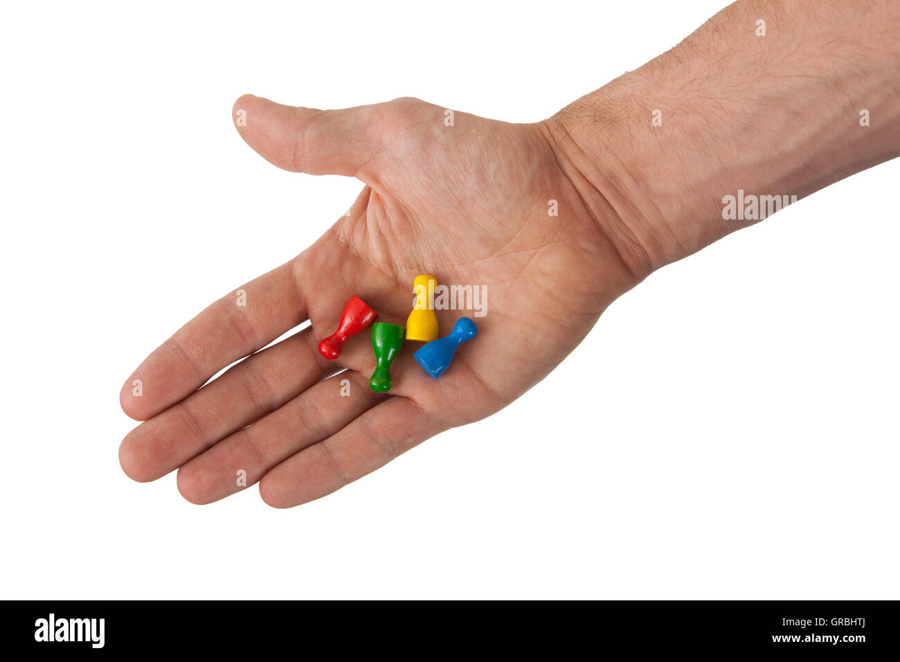 Hand holding four pawns Stock Photo - Alamy