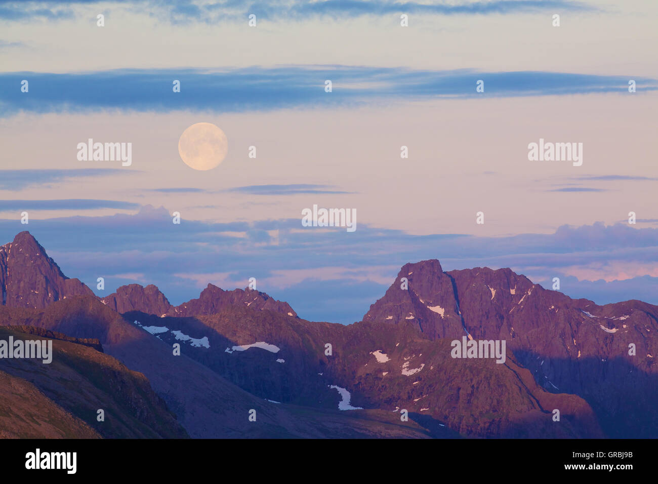 Moon over mountains Stock Photo - Alamy