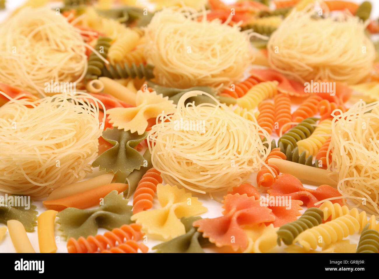 different pasta in three colors close-up Stock Photo - Alamy