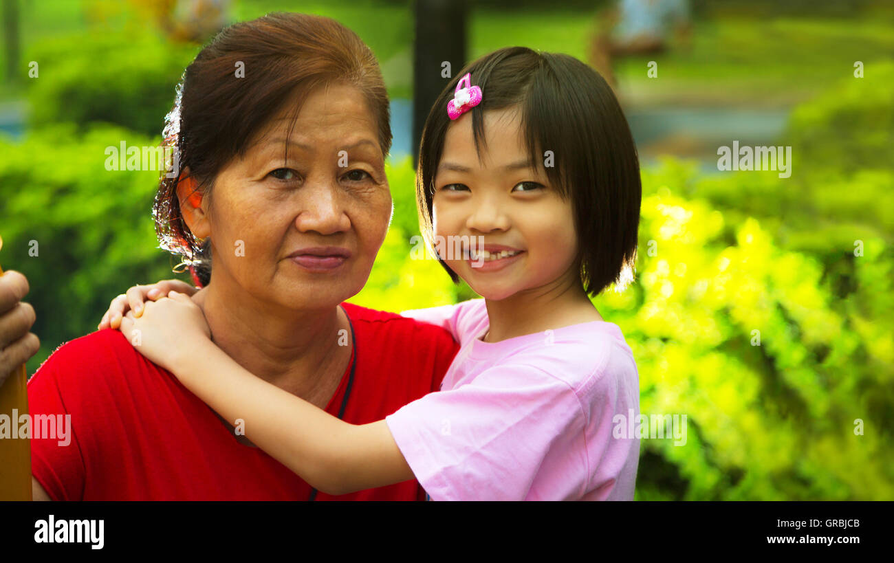 Asian grandma carrying child hi-res stock photography and images - Alamy