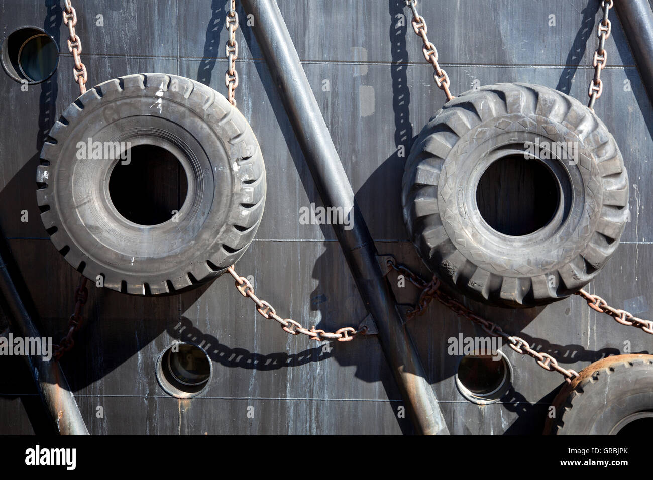 old tires used for protection of ship Stock Photo - Alamy