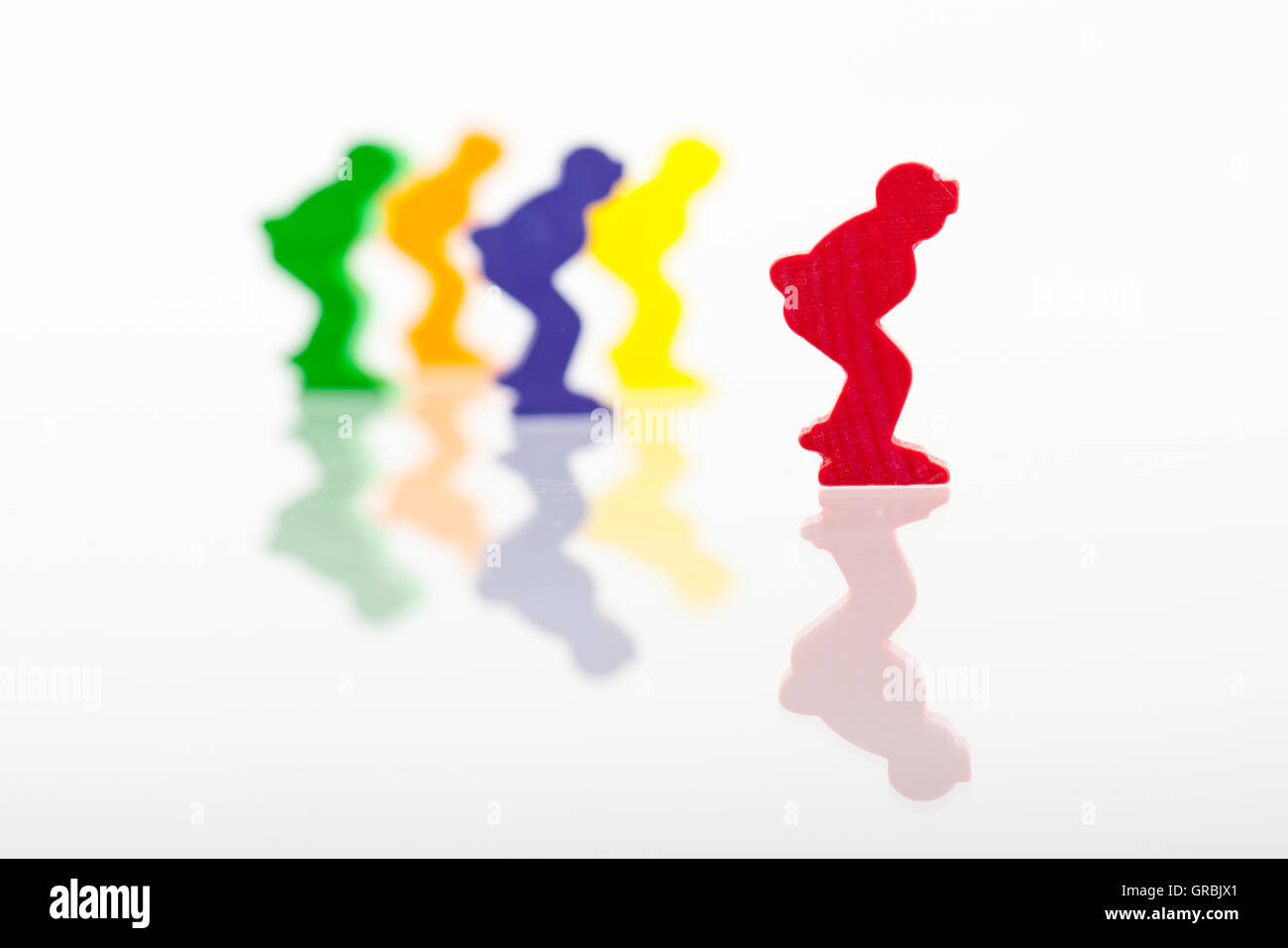 Five colored pawns isolated on a white background Stock Photo - Alamy