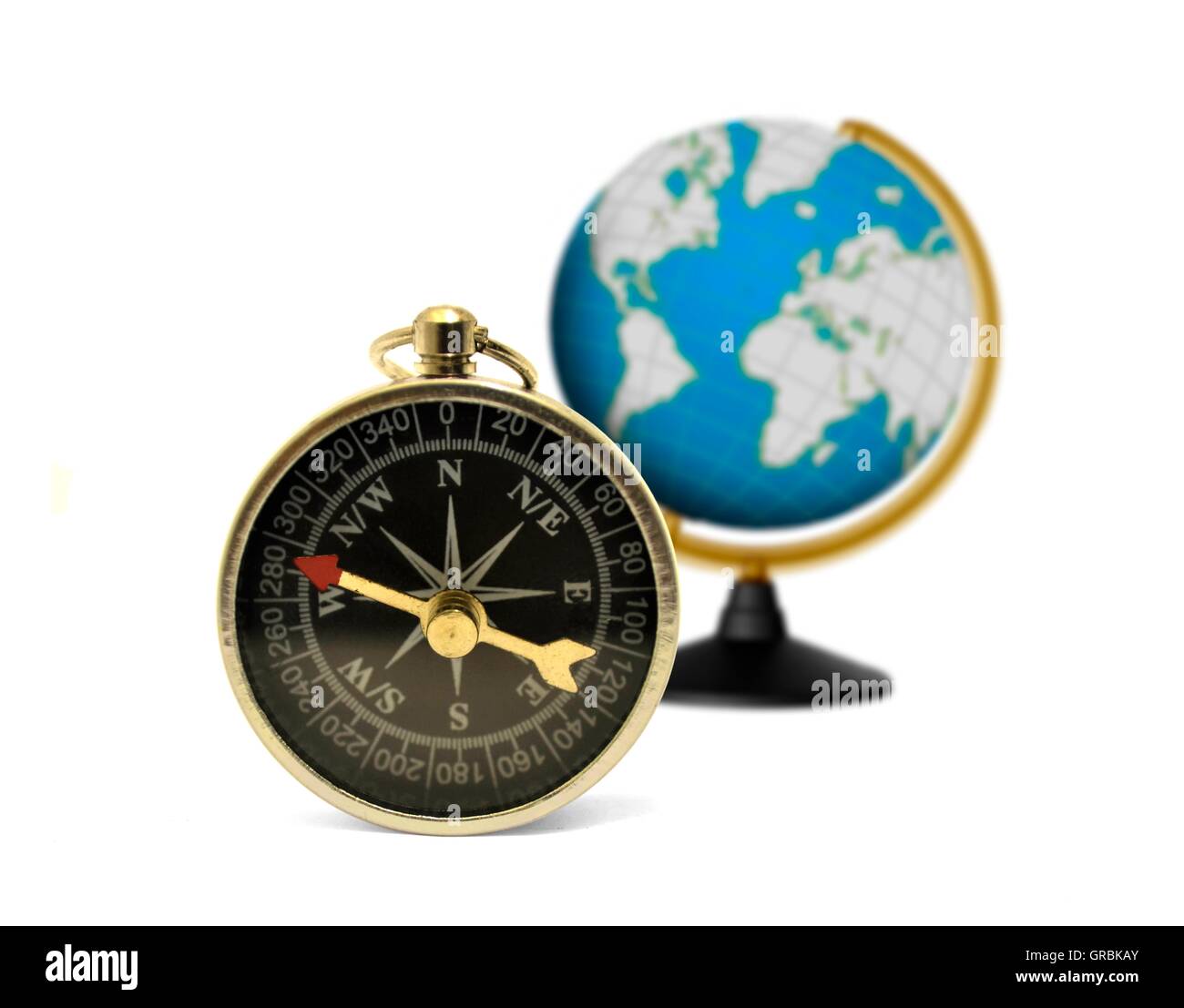 Compass and globe Stock Photo - Alamy