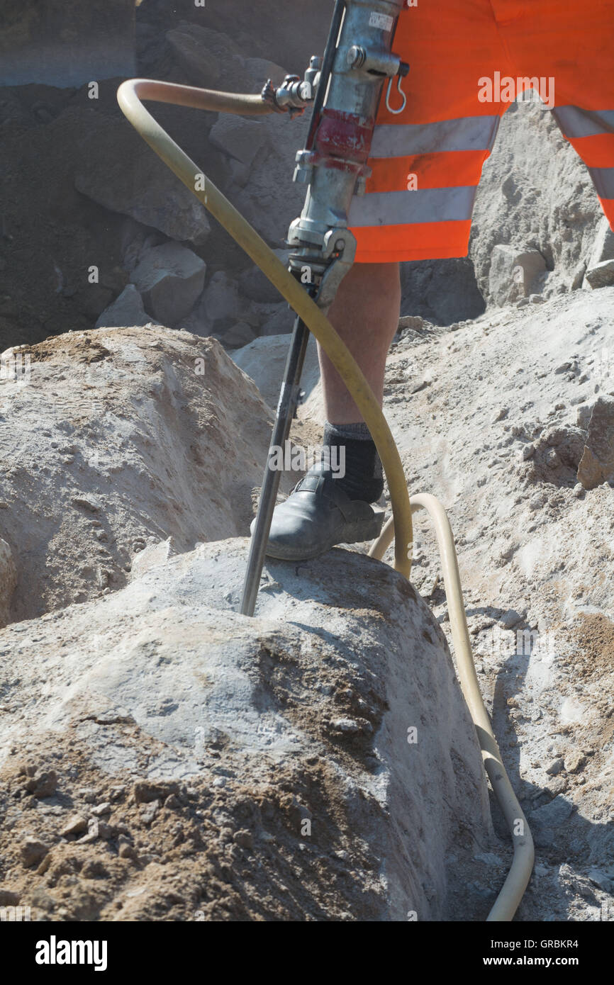 Construction Workers Working With Demolition Hammer On Stone Stock ...