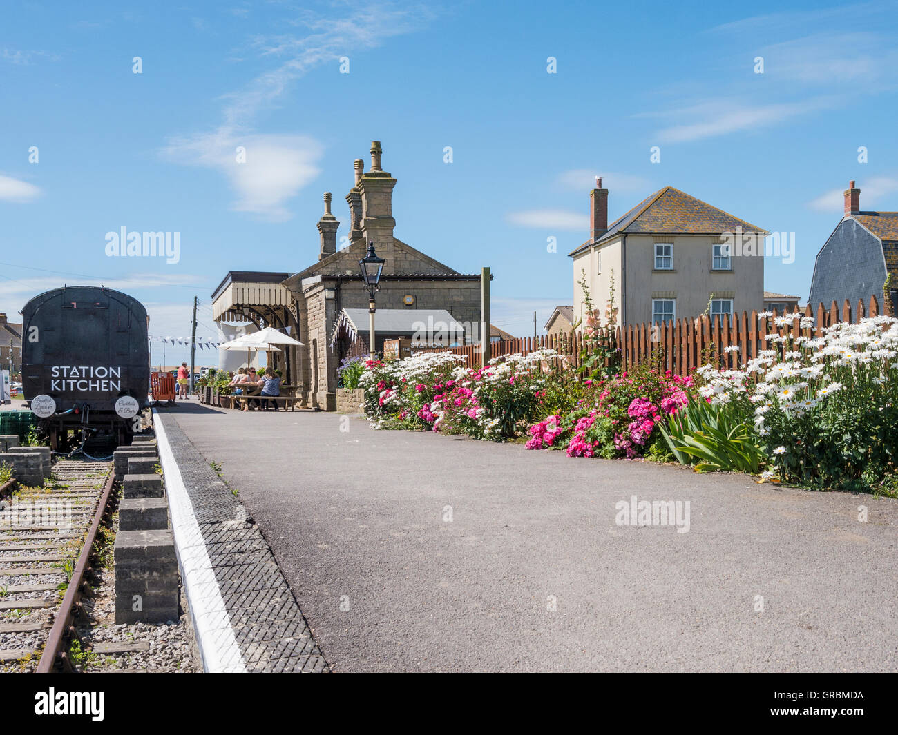 Flowers on the railway platform, West Bay, Dorset Stock Photo - Alamy