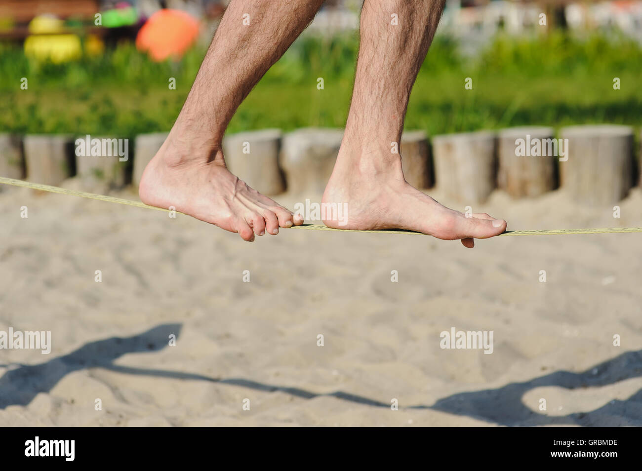 Man walking on the sling Stock Photo - Alamy