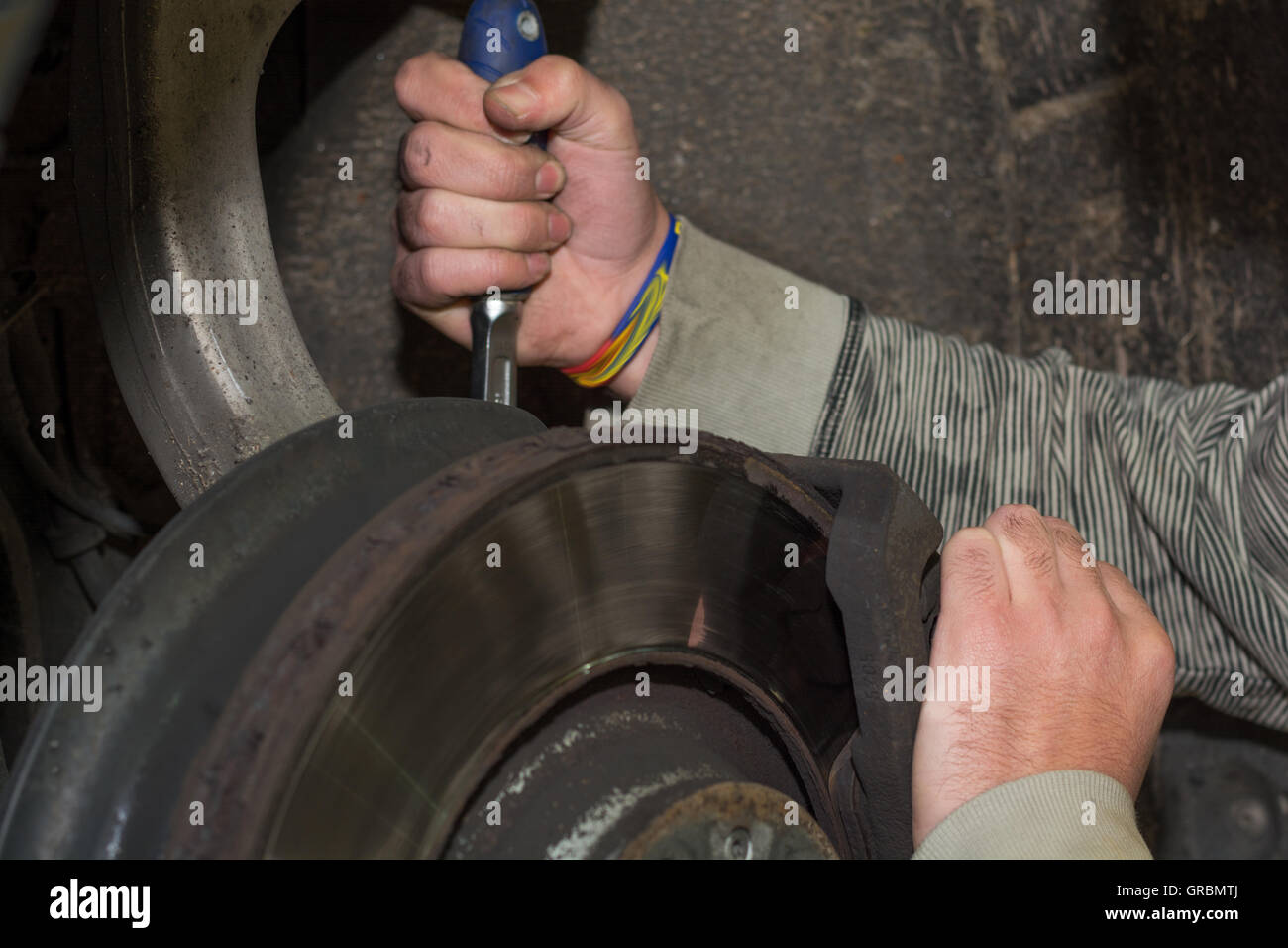 Mechanic Repaired With Ratchet Brake In A Car Stock Photo - Alamy