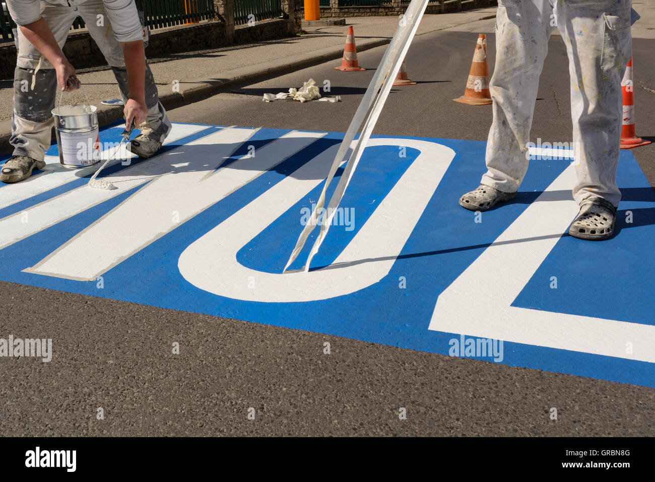 Road Marking Work Of Street Workers - Closeup Stock Photo - Alamy